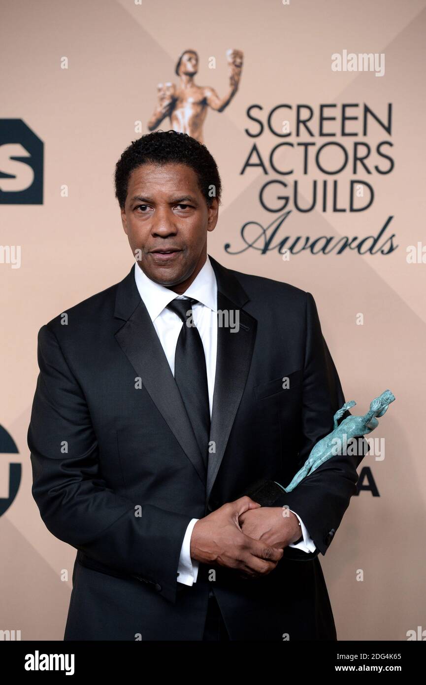 Denzel Washington poses in the press room during the 23rd Annual Screen ...