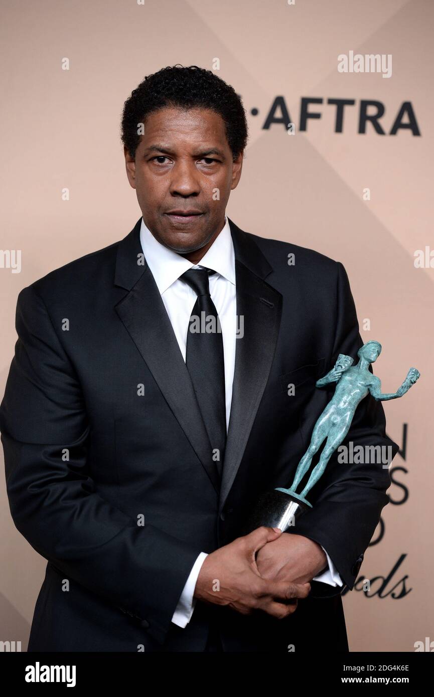 Denzel Washington poses in the press room during the 23rd Annual Screen ...