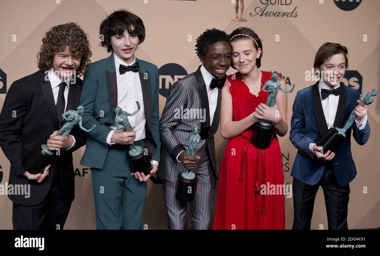 Finn Wolfhard, Gaten Matarazzo, Millie Bobby Brown, Noah Schnapp, and Caleb McLaughlin pose in ...