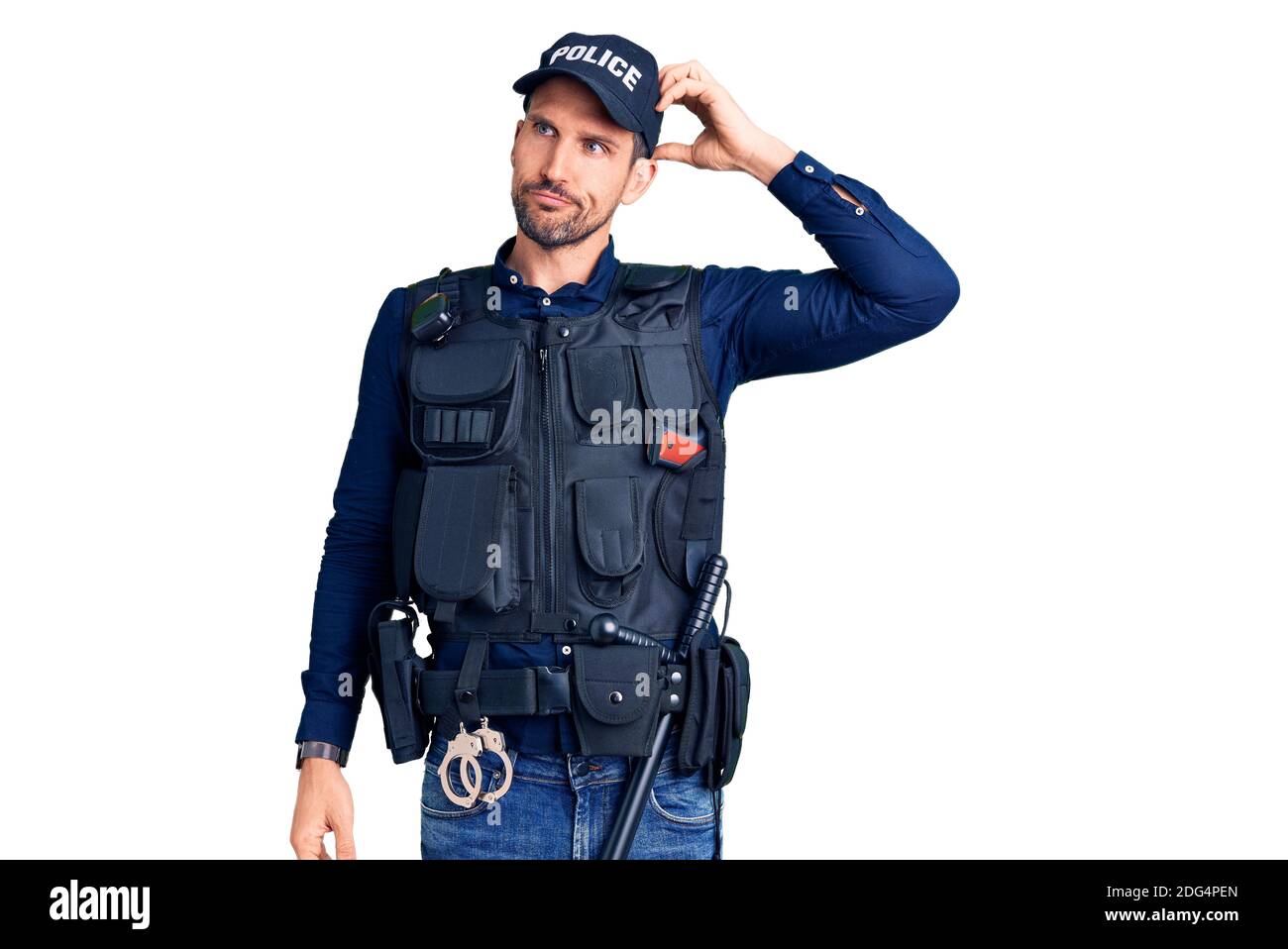 Young handsome man wearing police uniform confuse and wondering about ...