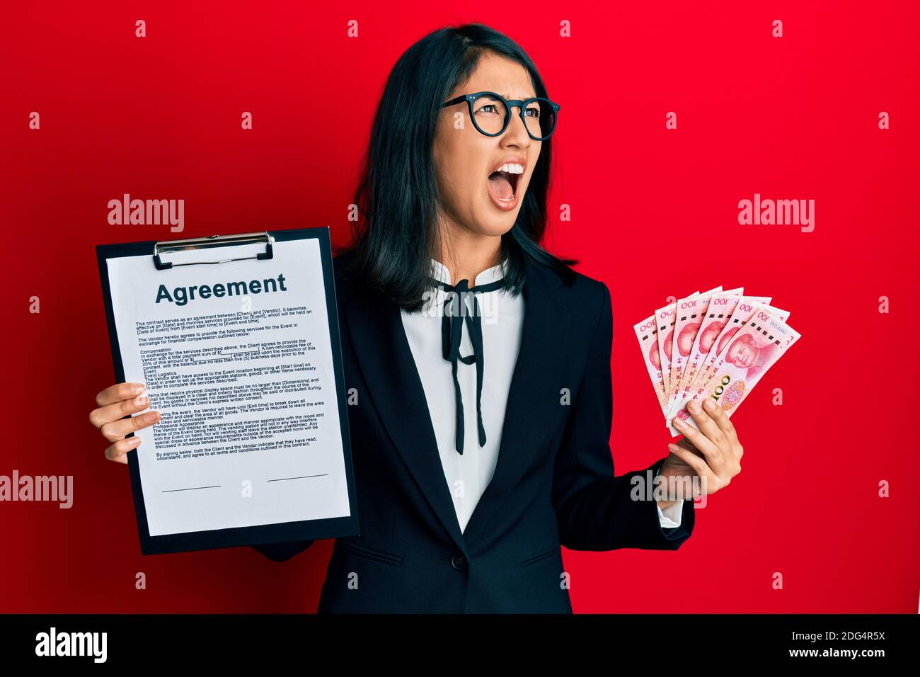 Beautiful asian young business woman holding agreement document and 100 ...
