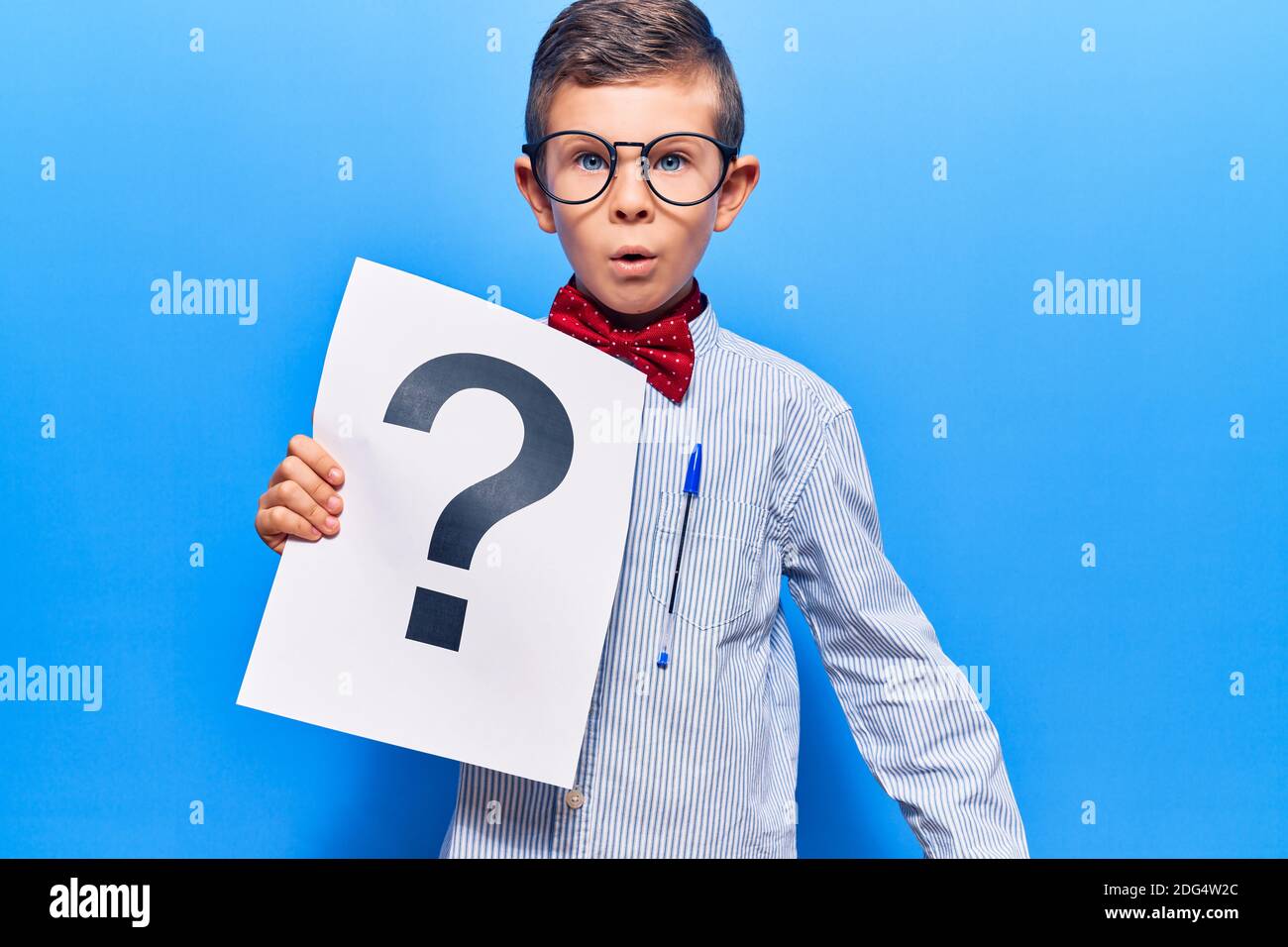 Cute blond kid wearing nerd bow tie and glasses holding question mark ...