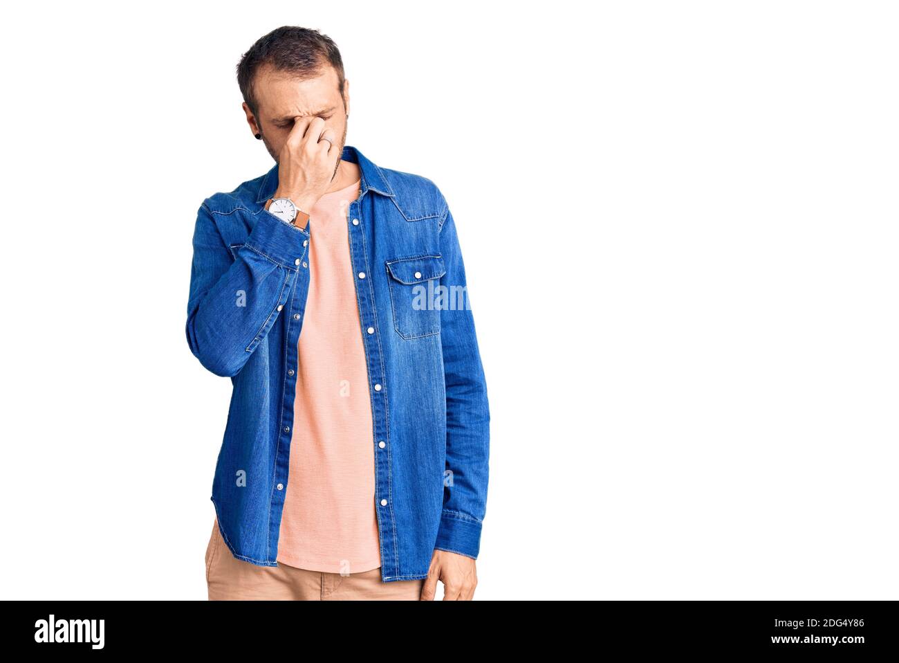 Young handsome man wearing casual clothes tired rubbing nose and eyes ...
