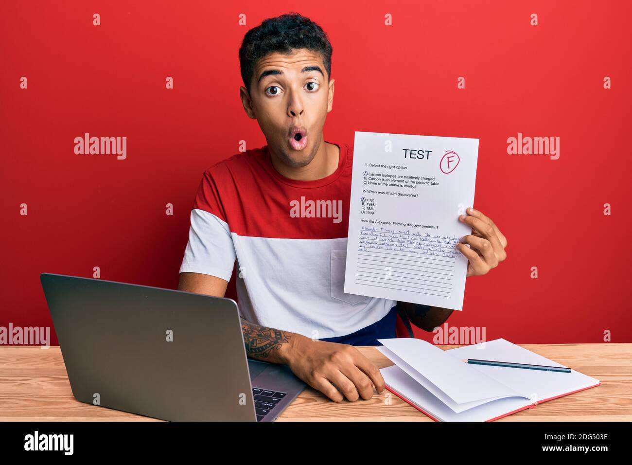 Young handsome african american man showing failed exam scared and ...