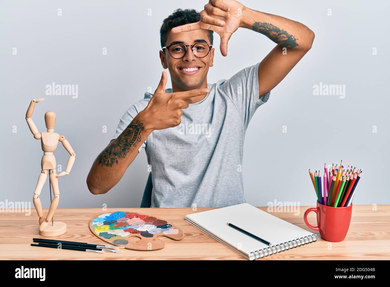 Young handsome african american man painter sitting palette and art ...