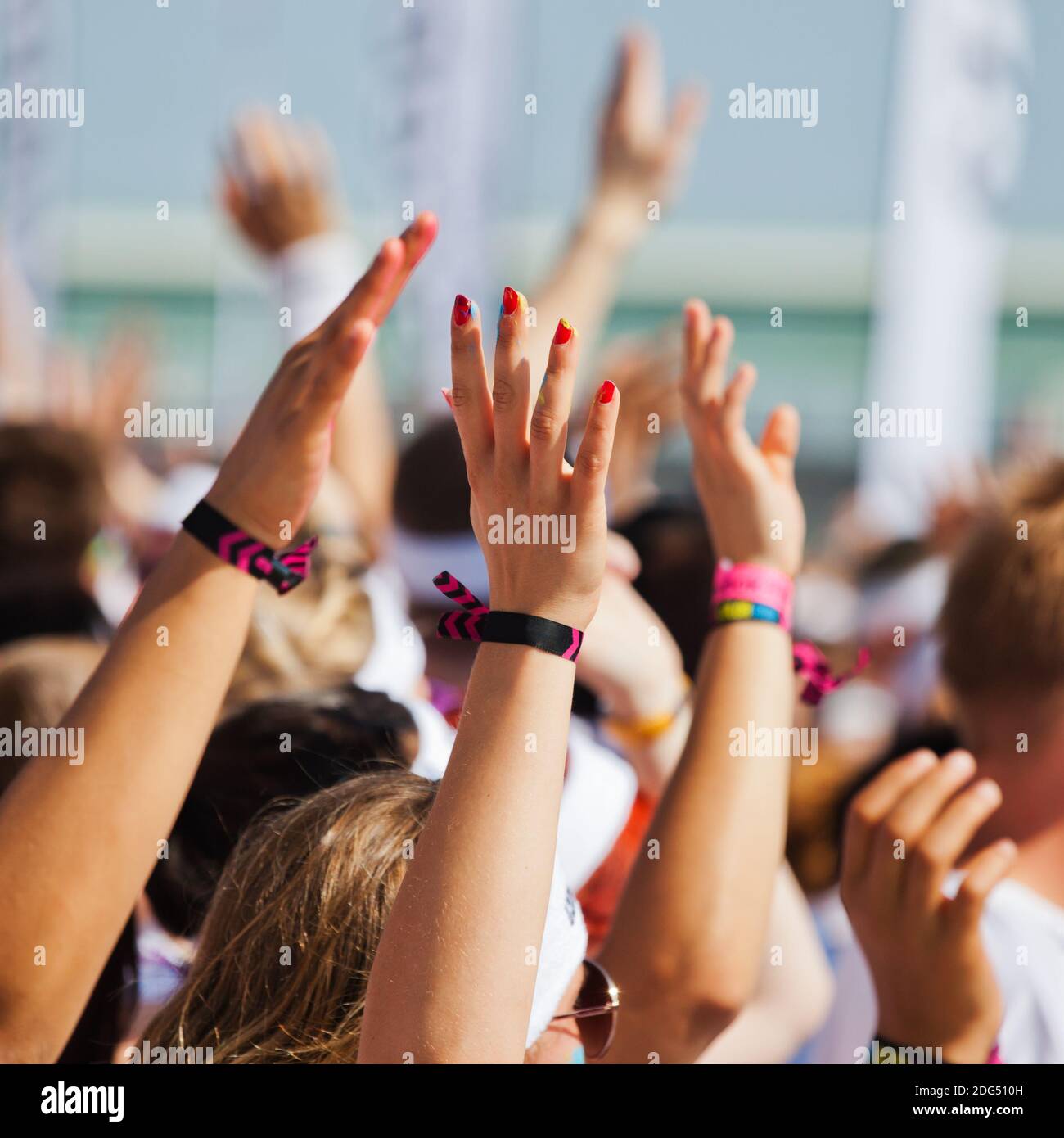 Crowd of people raising their hands to cheer Stock Photo - Alamy
