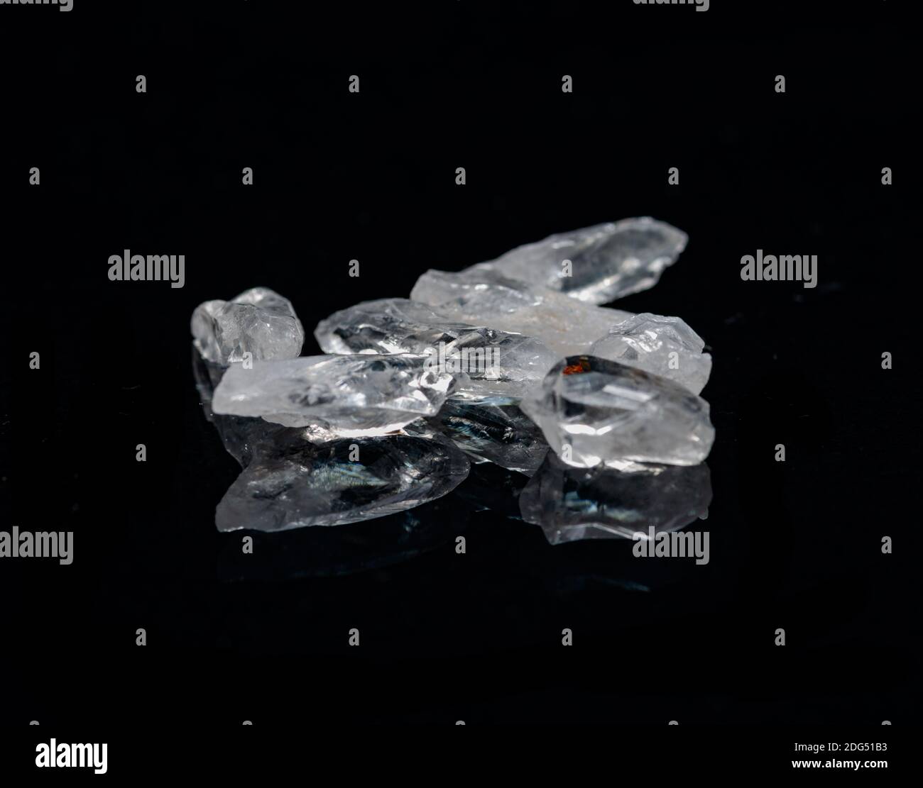 Clear Satyaloka Quartz from Southern India isolated on a black mirror ...