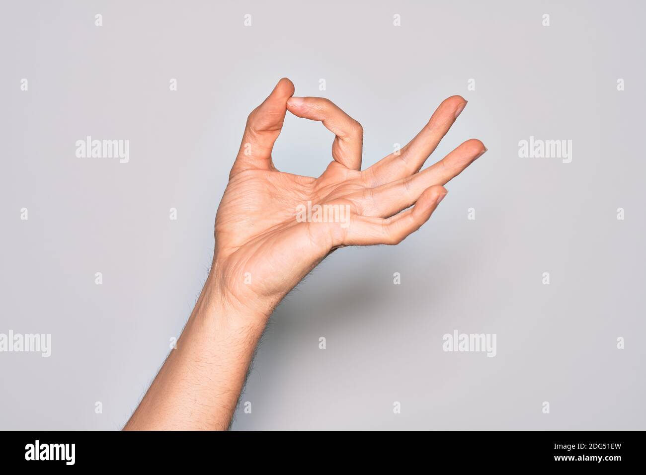 Hand of caucasian young man showing fingers over isolated white ...