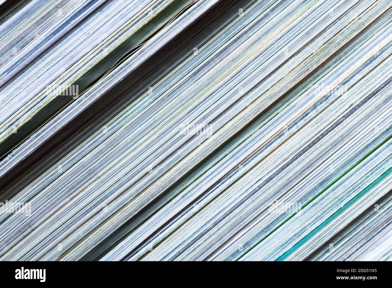 Diagonal view of a pile of magazines Stock Photo - Alamy