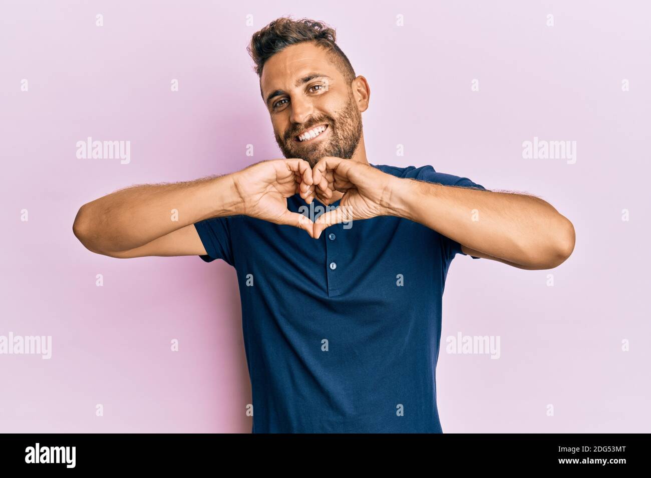 Handsome man with beard wearing casual clothes smiling in love doing ...