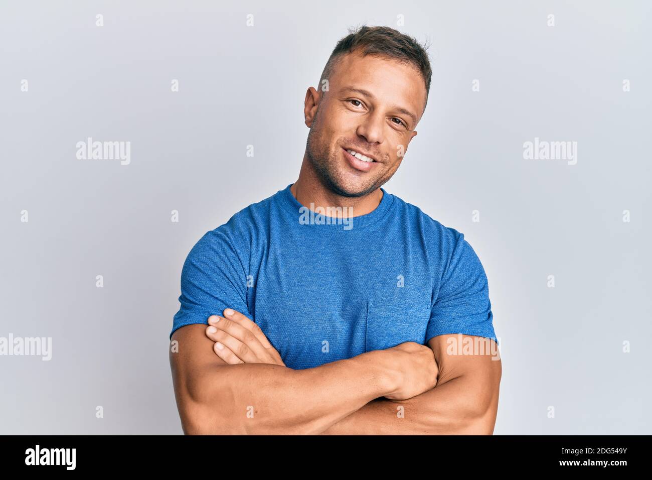 Handsome muscle man wearing casual clothes happy face smiling with ...