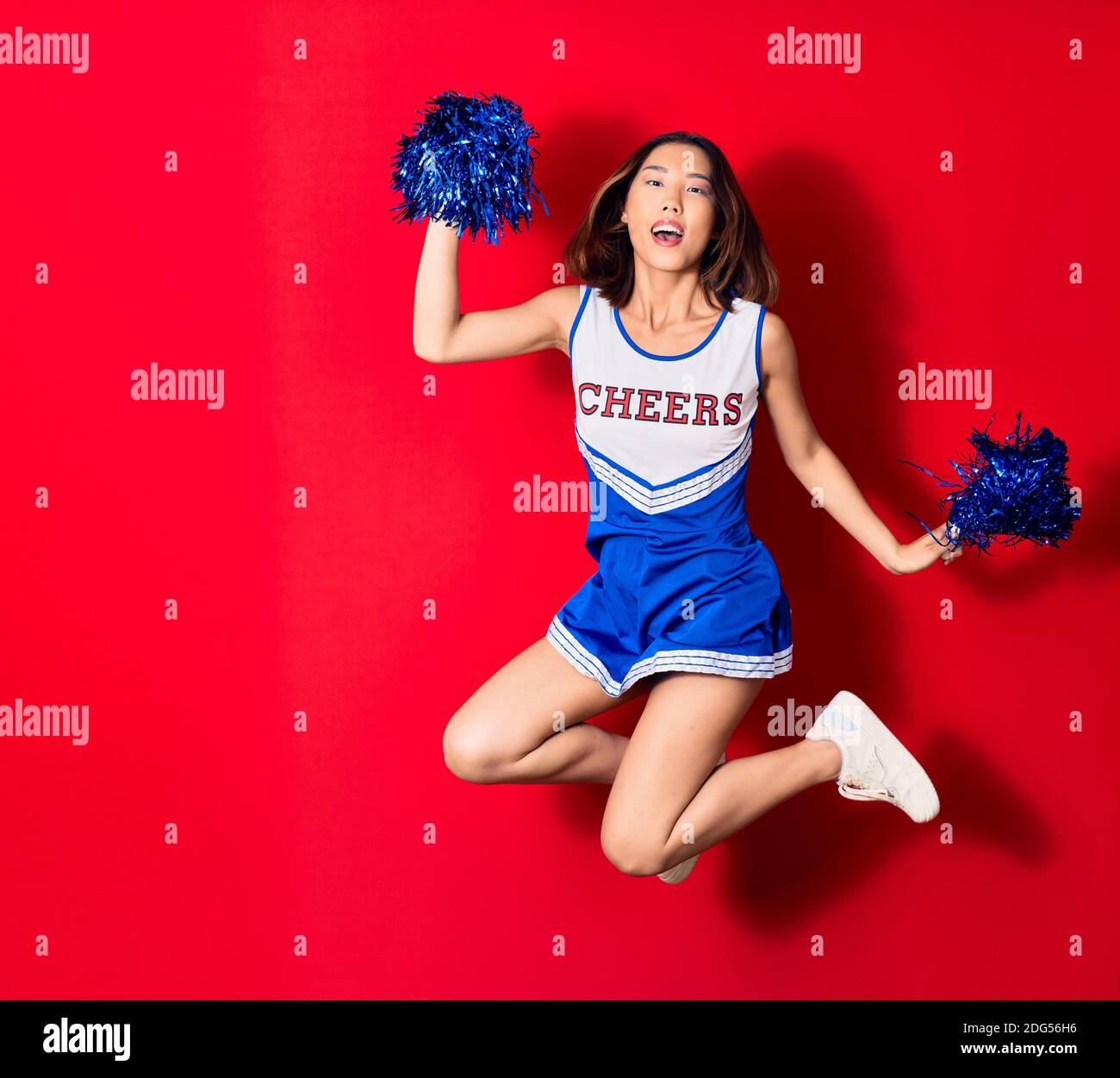 Young Beautiful Chinese Girl Smiling Happy Wearing Cheerleader Uniform 9933