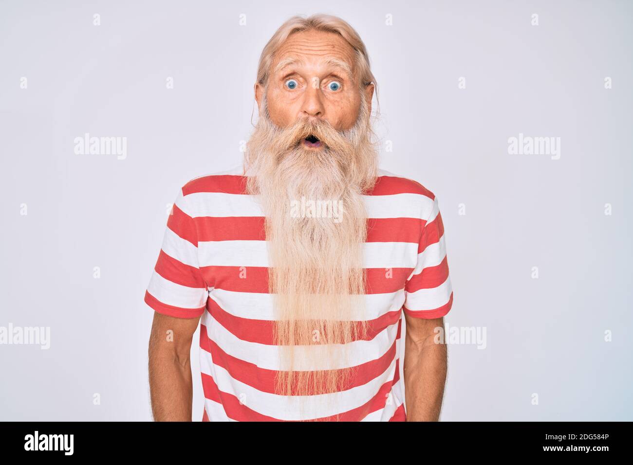 Old senior man with grey hair and long beard wearing striped tshirt ...