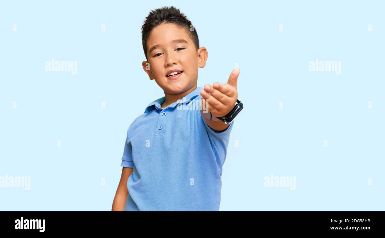Little boy hispanic kid wearing casual clothes smiling friendly ...