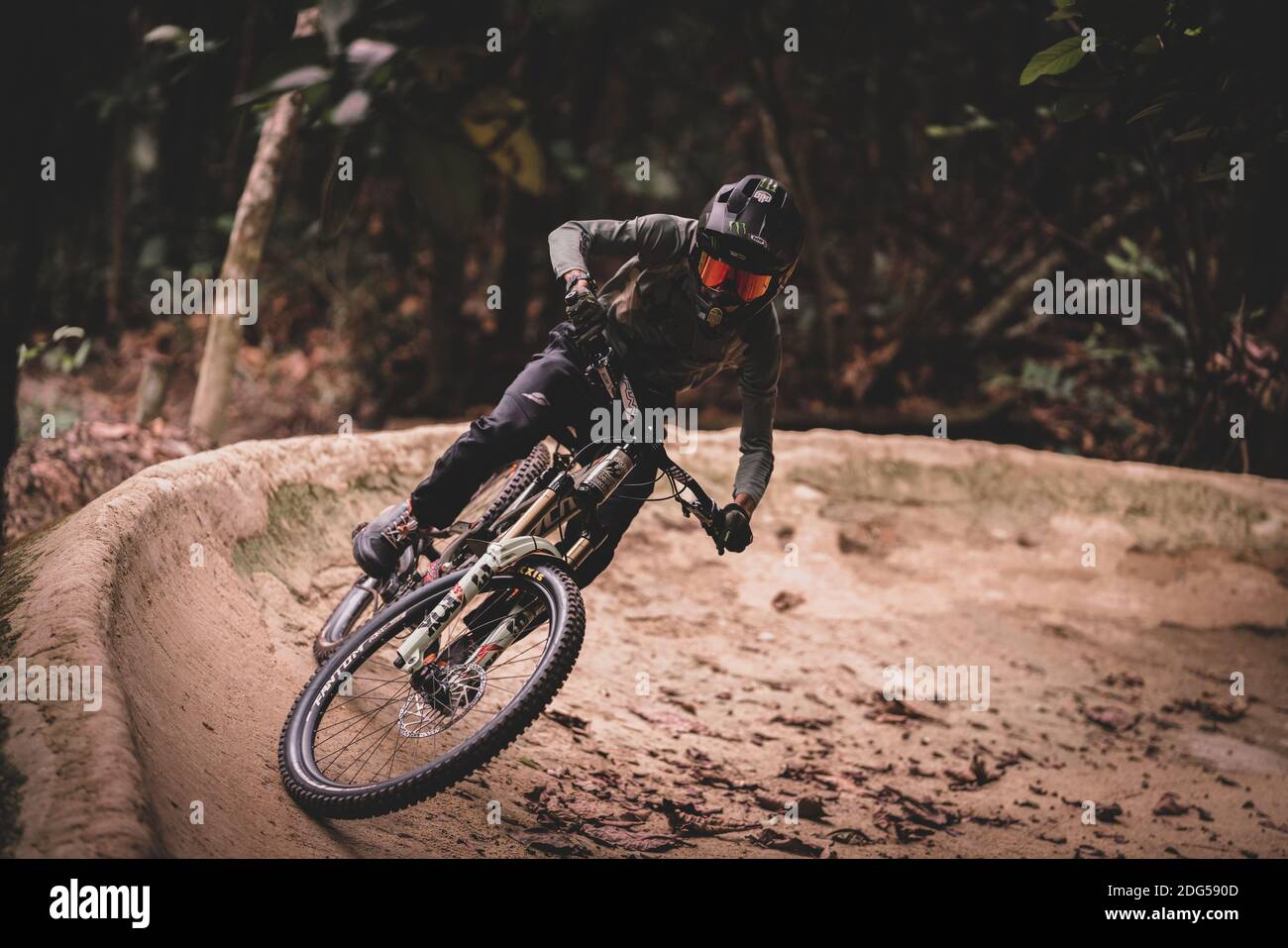 Mountain Biker riding aggressively through a berm Stock Photo - Alamy