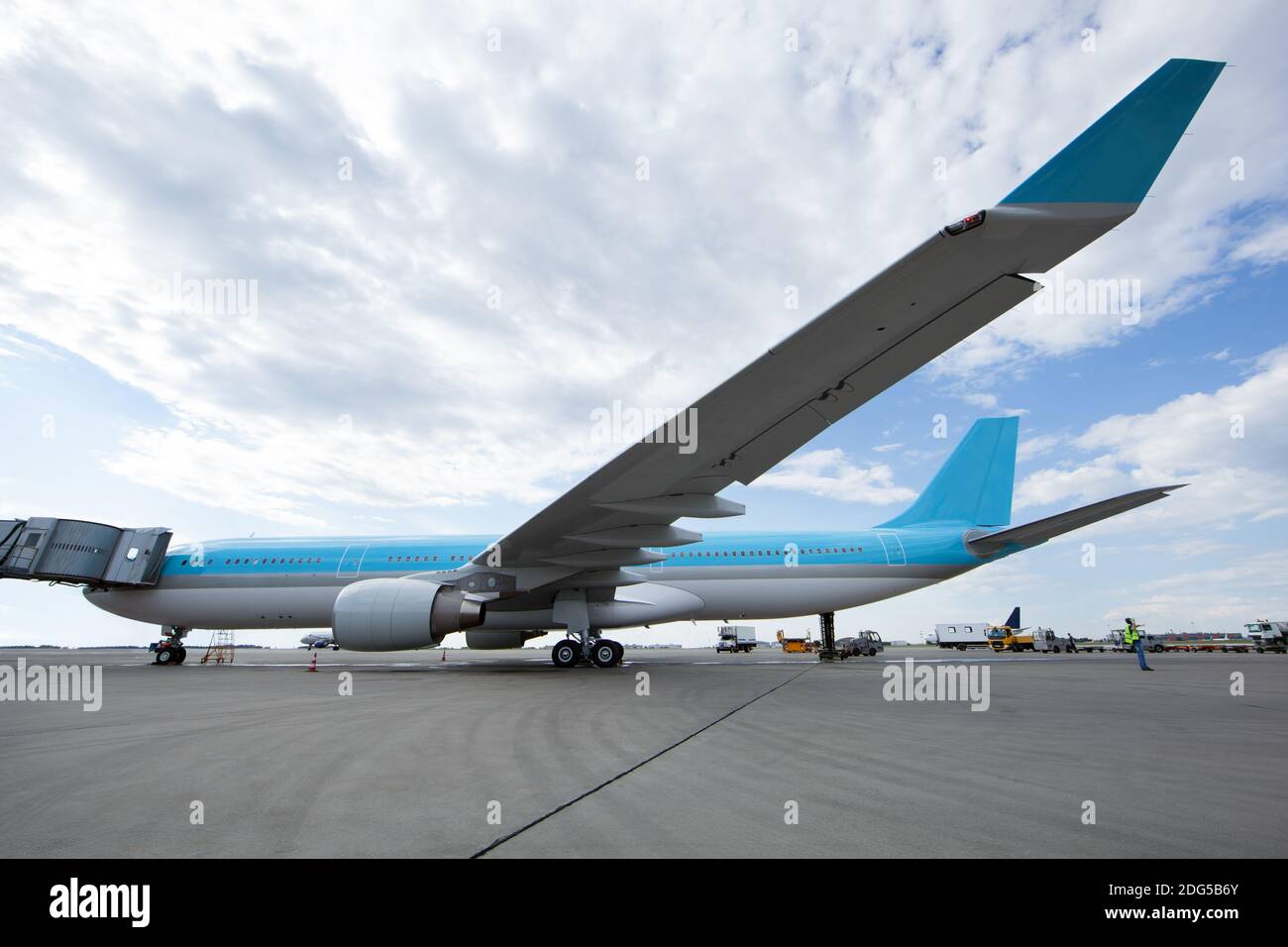Modern airplane stands at the airport Stock Photo - Alamy