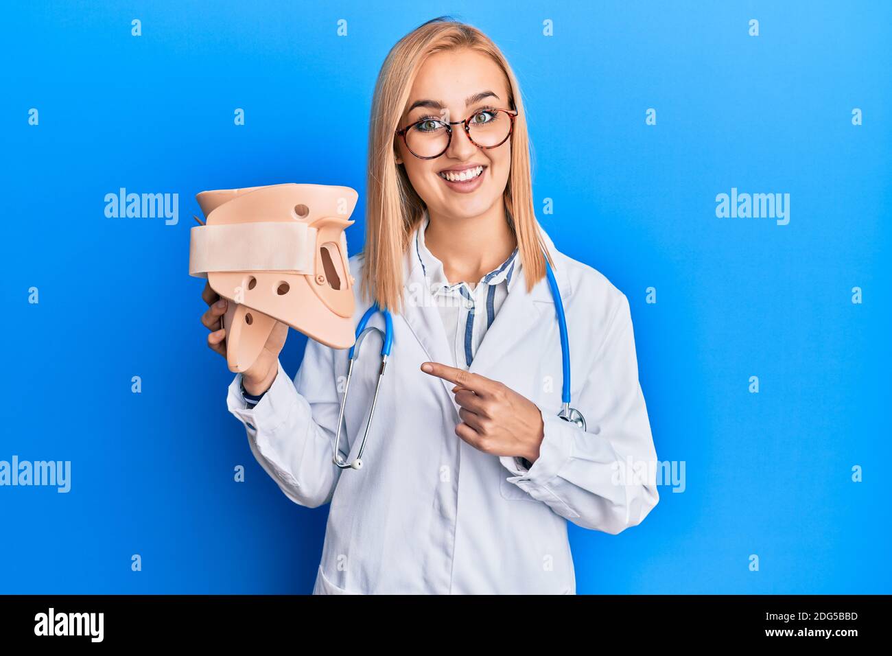 Beautiful caucasian doctor woman holding cervical neck collar smiling ...