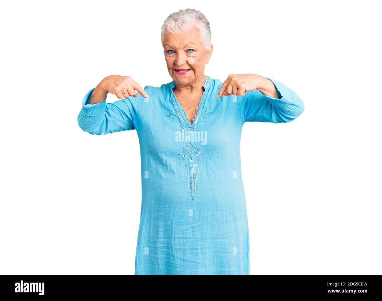 Senior beautiful woman with blue eyes and grey hair wearing summer ...
