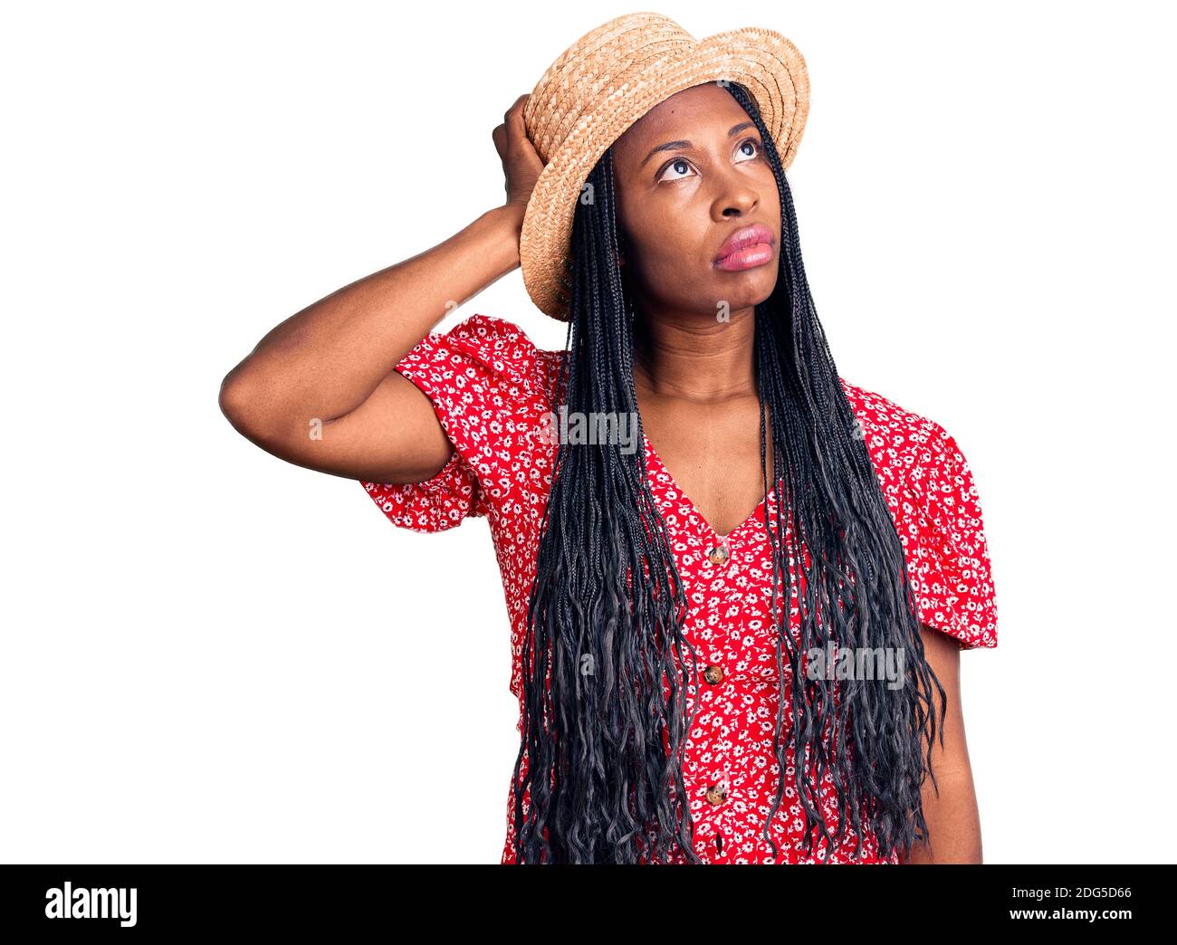 Young african american woman wearing summer hat confuse and wondering ...