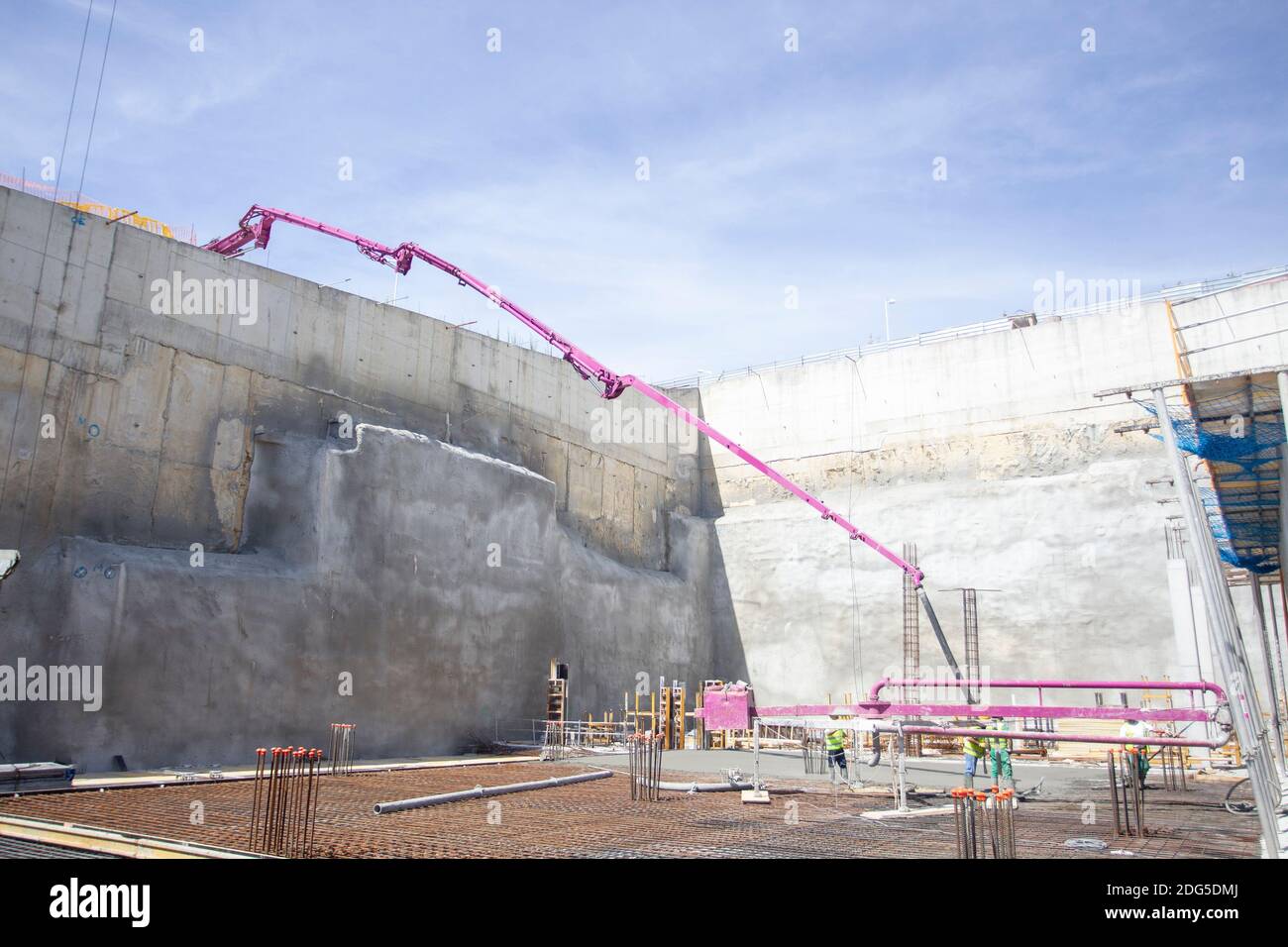 Concrete pump extended on construction site under construction Stock ...