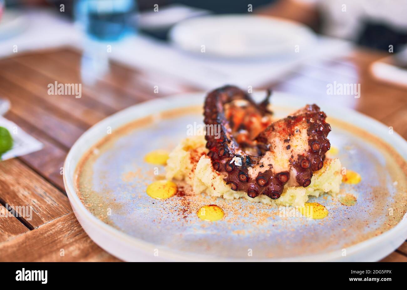 Delicious dish of grilled octopus seafood Stock Photo - Alamy