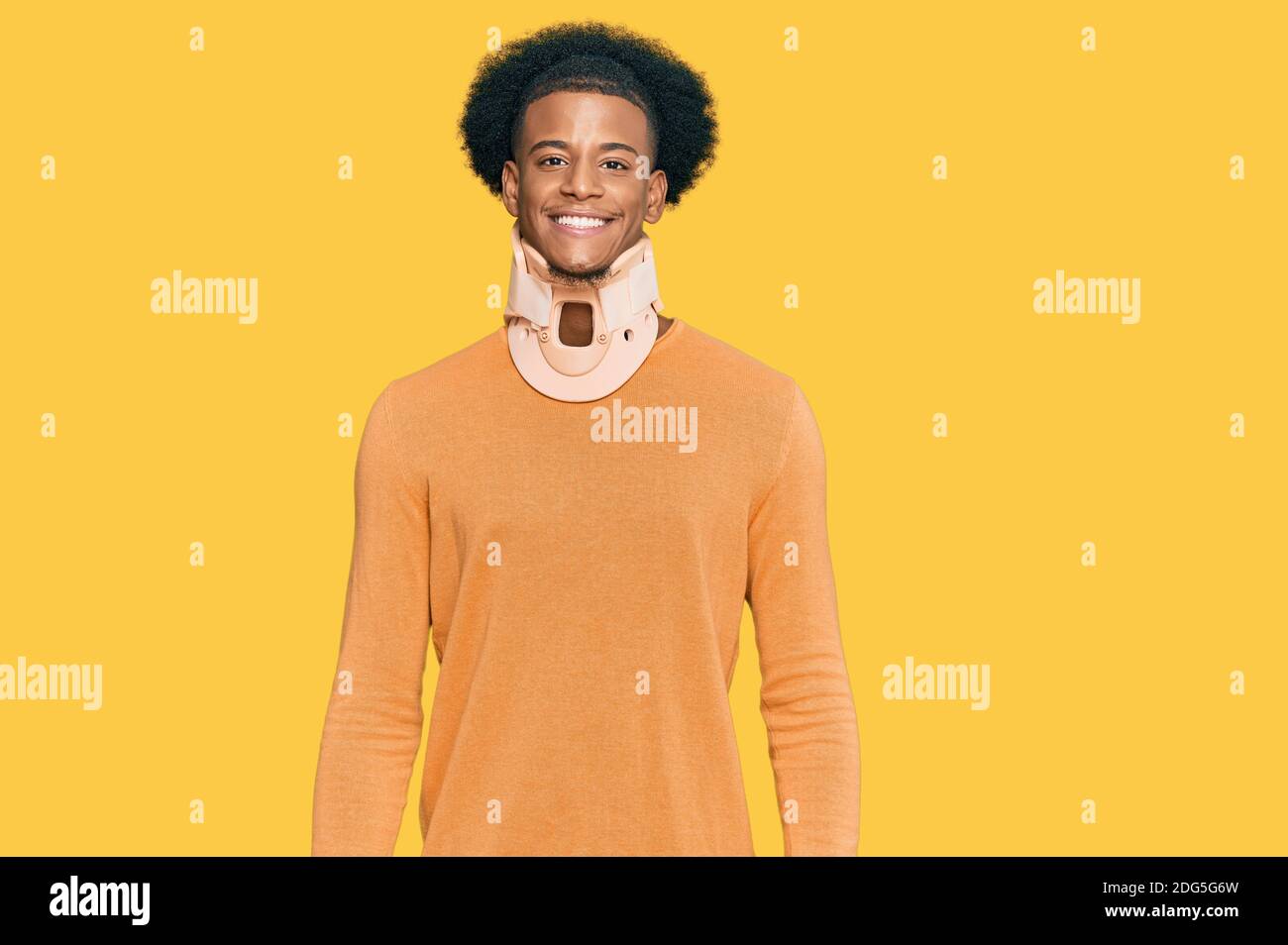 African american man with afro hair wearing cervical neck collar with a ...