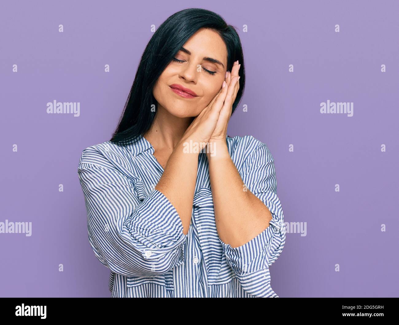 Young caucasian woman wearing casual clothes sleeping tired dreaming ...