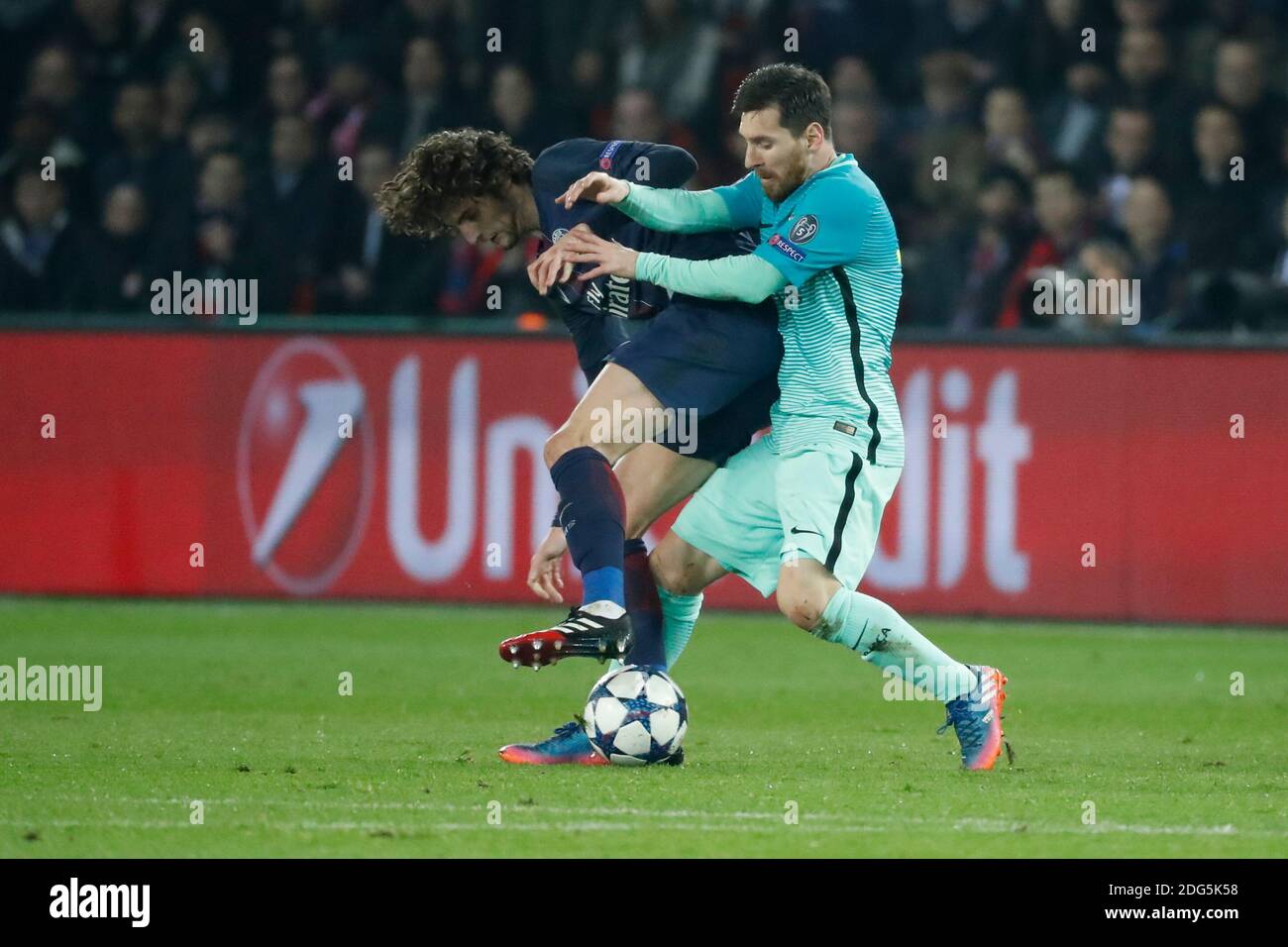 PSG's Adrien Rabiot battling Barcelona's Lionel Messi during the UEFA ...