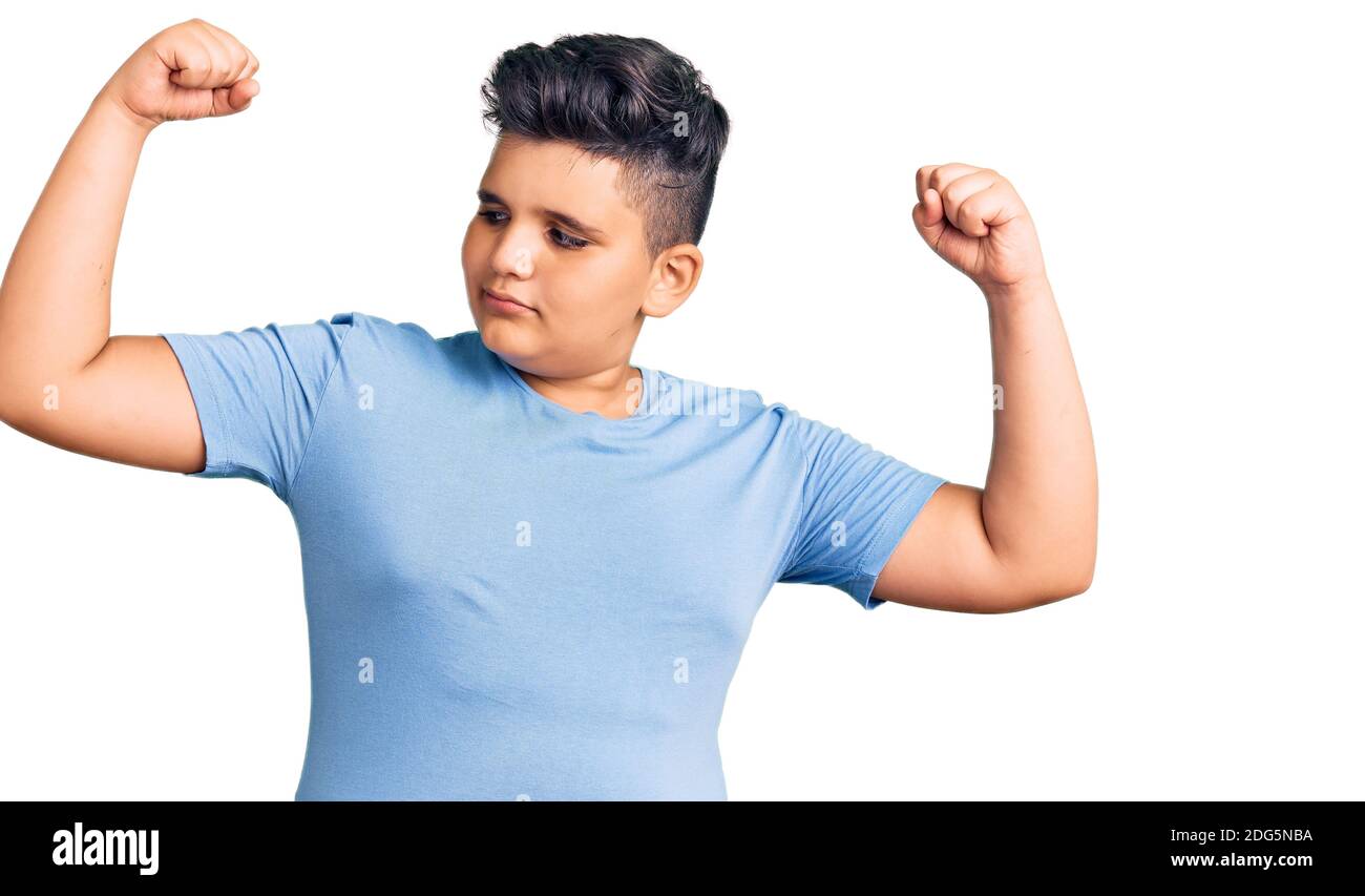 Little boy kid wearing sports workout clothes showing arms muscles ...