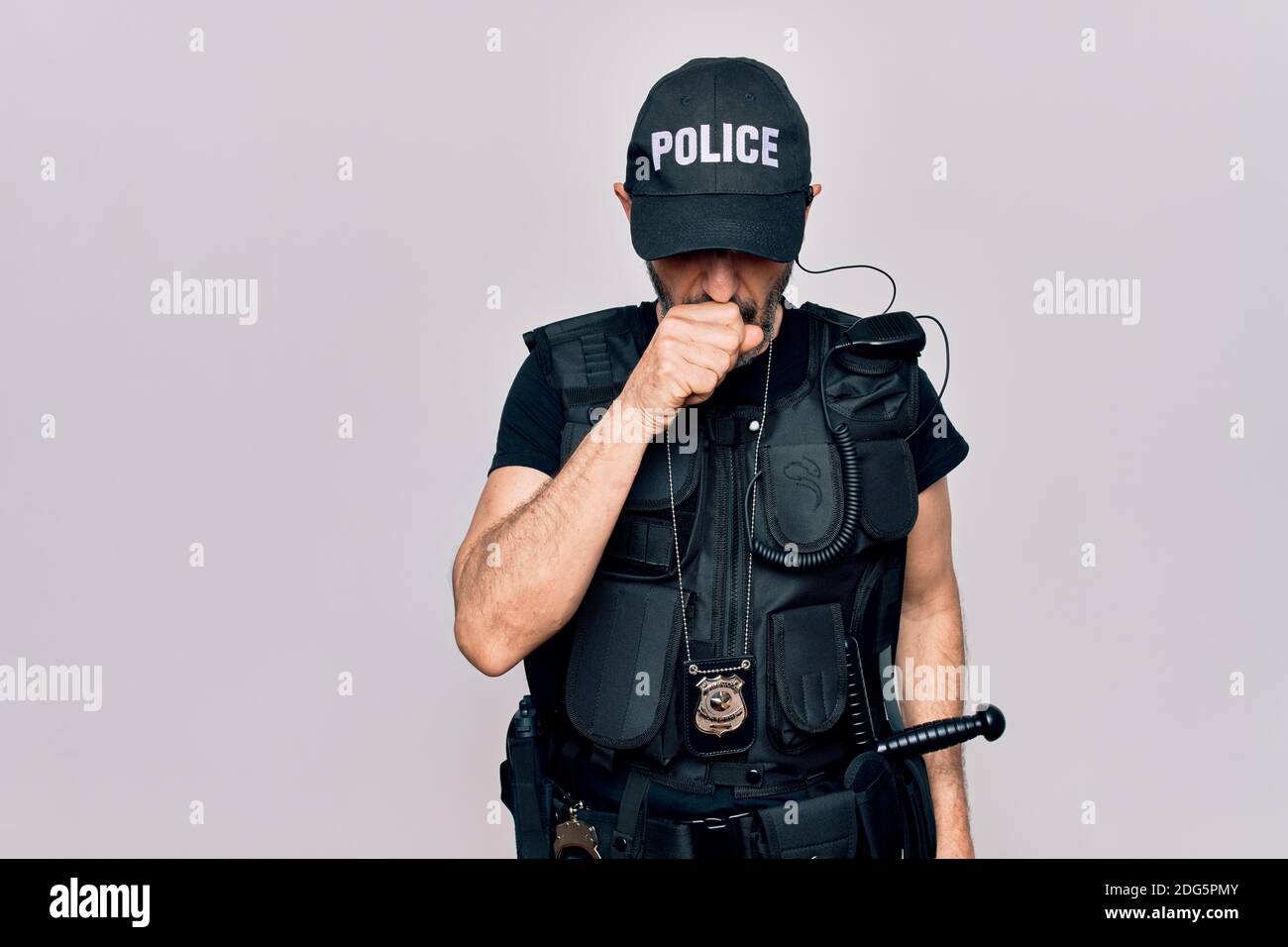 Middle age policeman wearing police uniform and bulletproof vest over ...