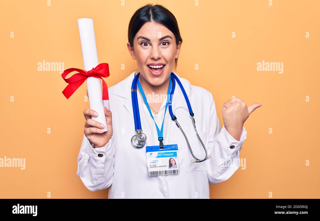 Young beautiful doctor woman wearing stethoscope holding diploma degree ...