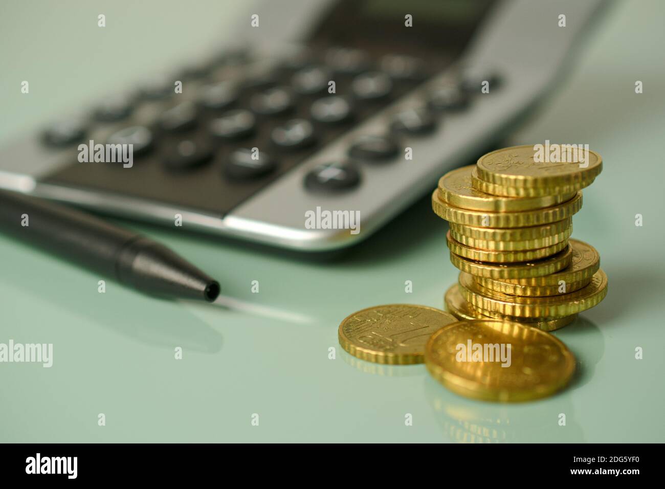 coins and calculator, money and calculator Stock Photo - Alamy