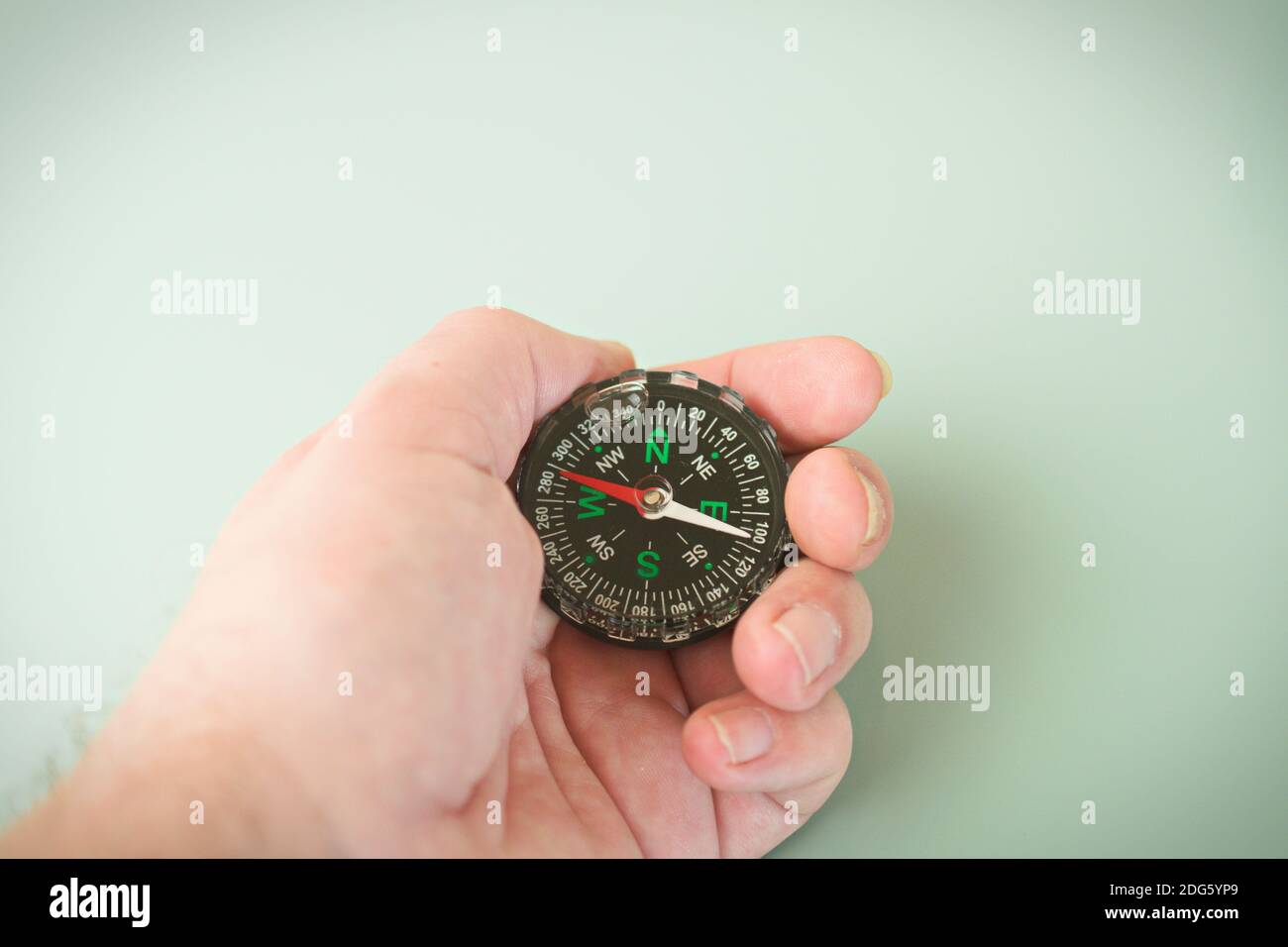hand holding a compass Stock Photo - Alamy