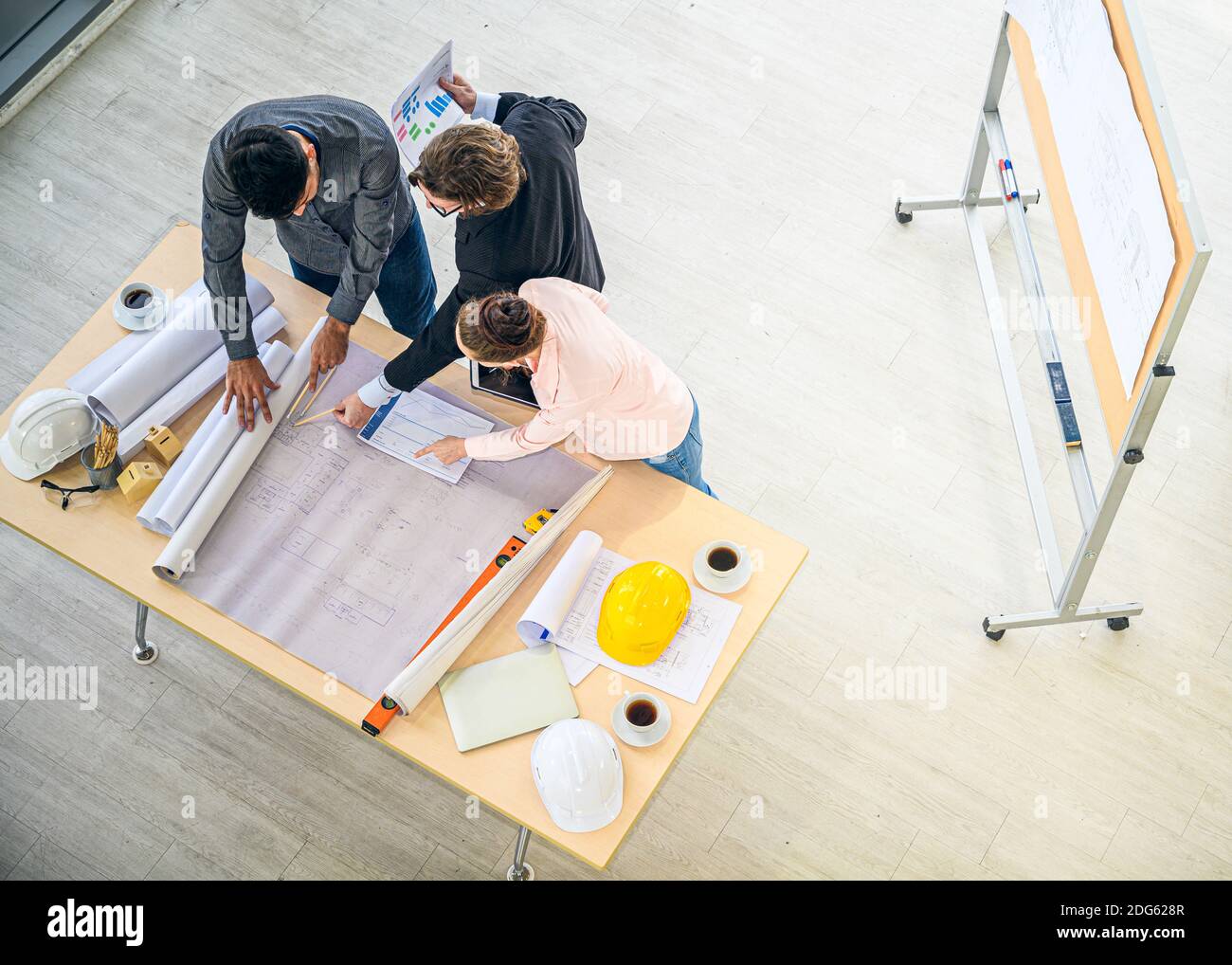 Top view of Caucasian engineer group teamwork meeting for planning ...