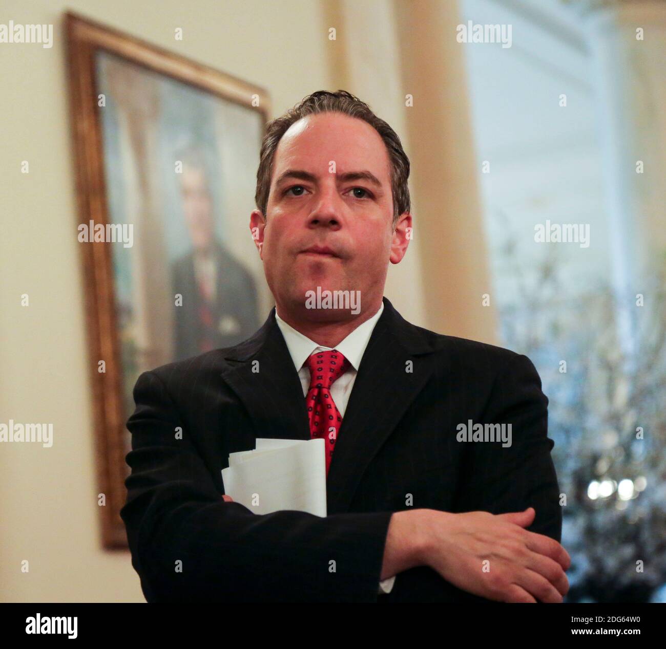 White House Chief of Staff Reince Priebus stands as U.S. President ...
