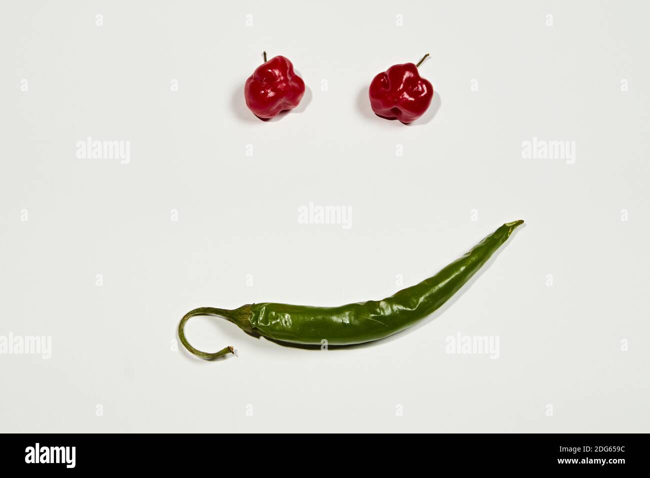 Vegetable chilli, chile face on white backgroung Stock Photo - Alamy