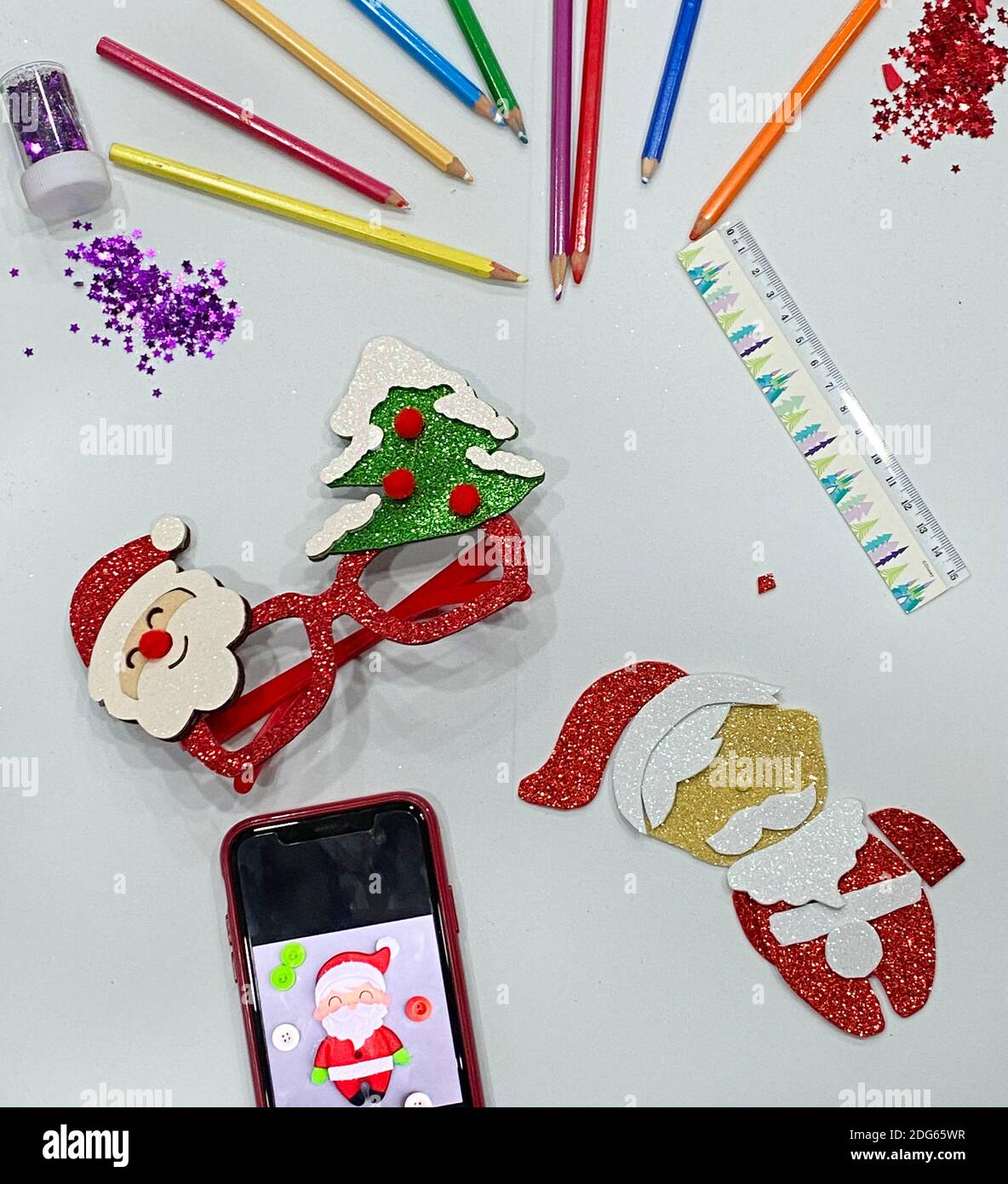 From above, toy glasses to celebrate Christmas, glitter, colored ...