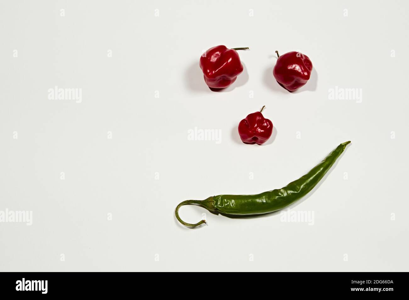 Vegetable chilli, chile face on white backgroung Stock Photo - Alamy