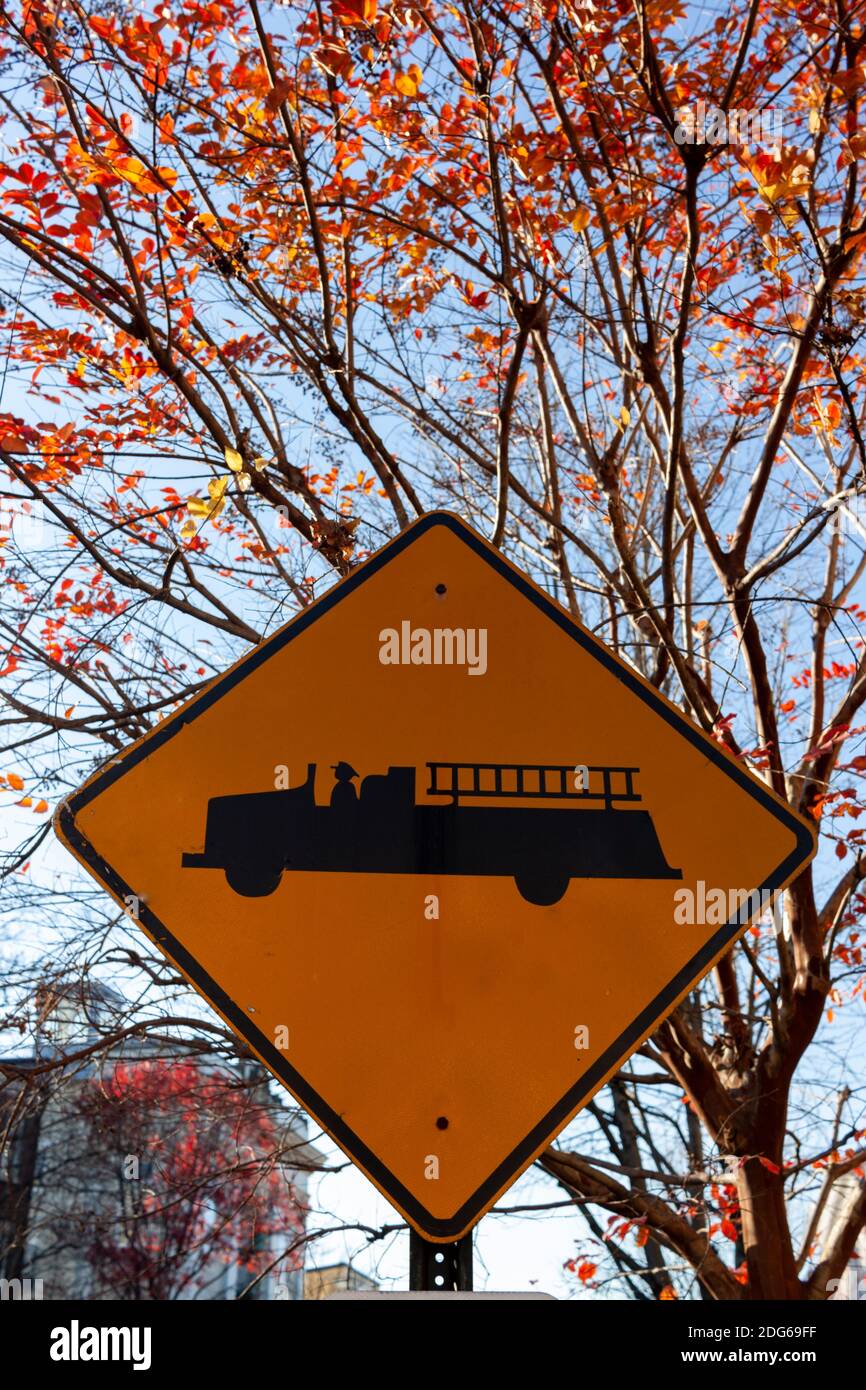 Emergency vehicle traffic sign on side of a road with a vintage fire ...