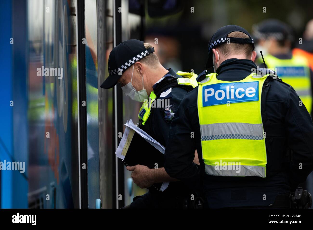Melbourne, Australia, 5 July, 2020. Police officers step into a mobile ...