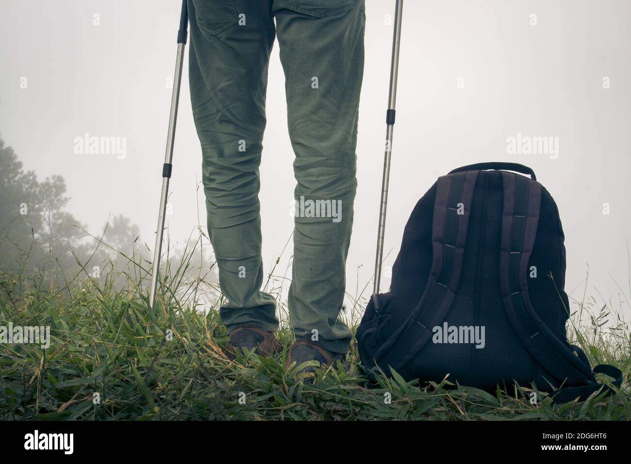 rear back view of man lower body standing in natural environment with ...