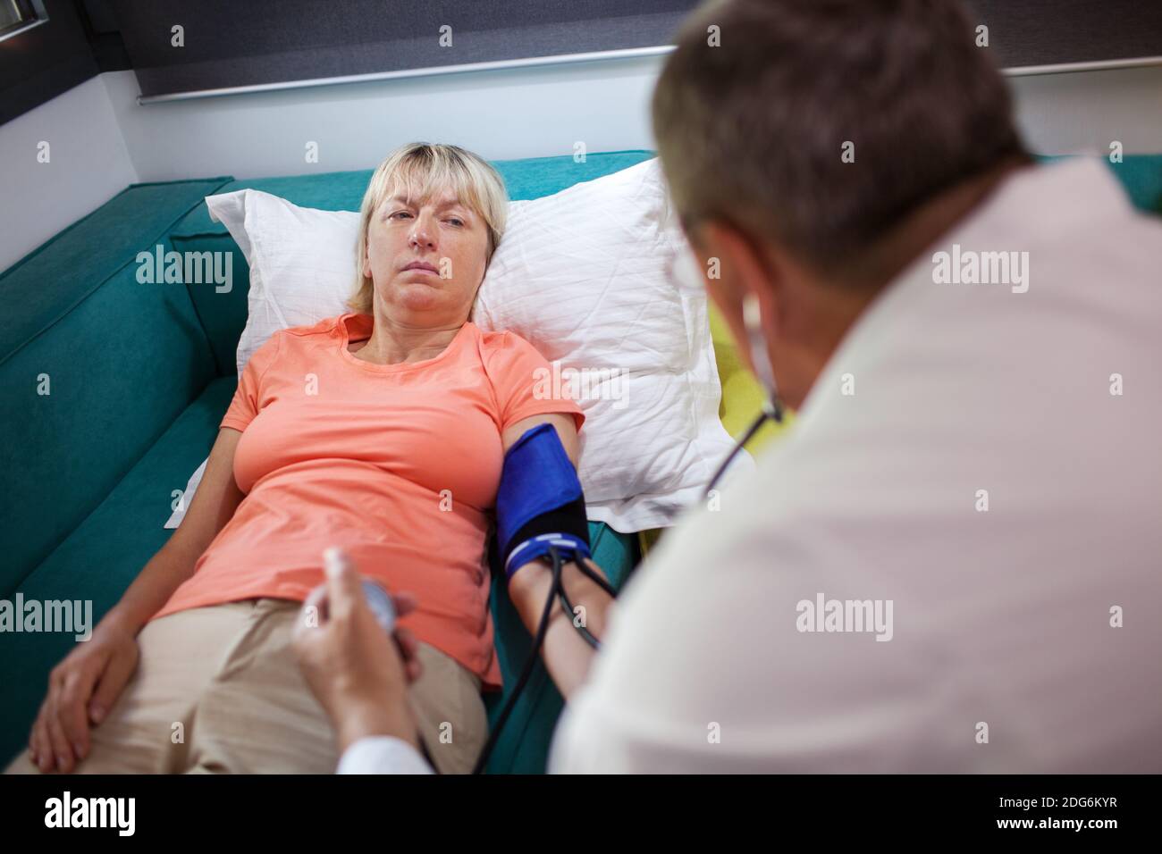 Blood pressure check woman doctor hi-res stock photography and images ...