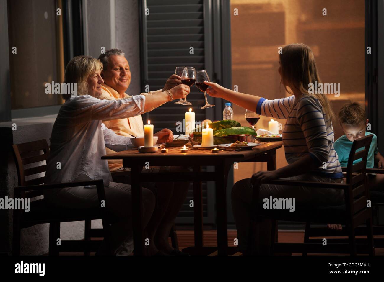Quiet family dinner in the backyard Stock Photo - Alamy