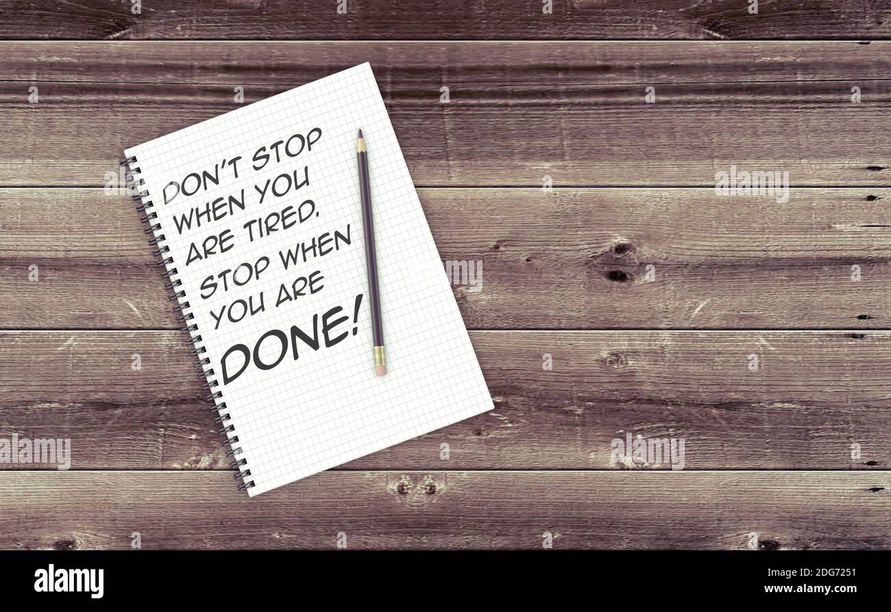 Inspirational quote on notepad Stock Photo - Alamy