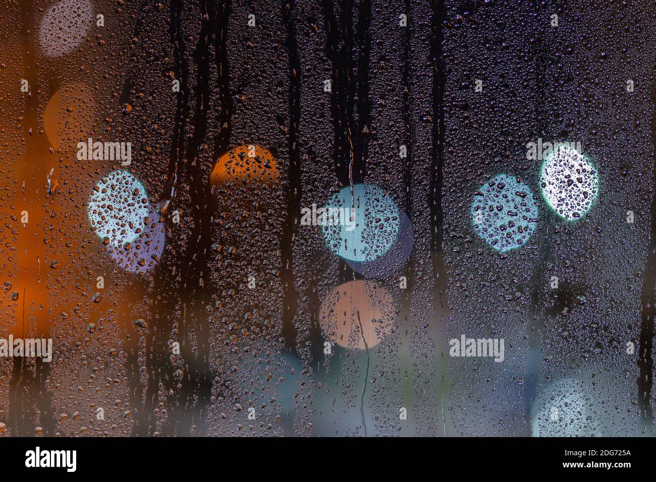 an abstract background of night wet window glass with smudges Stock ...