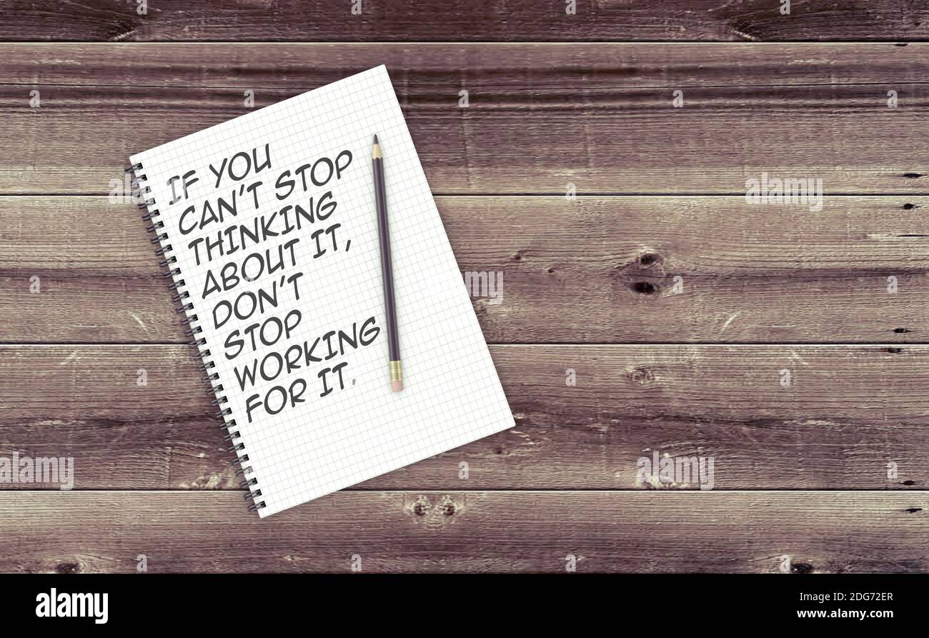 Inspirational quote on notepad Stock Photo - Alamy