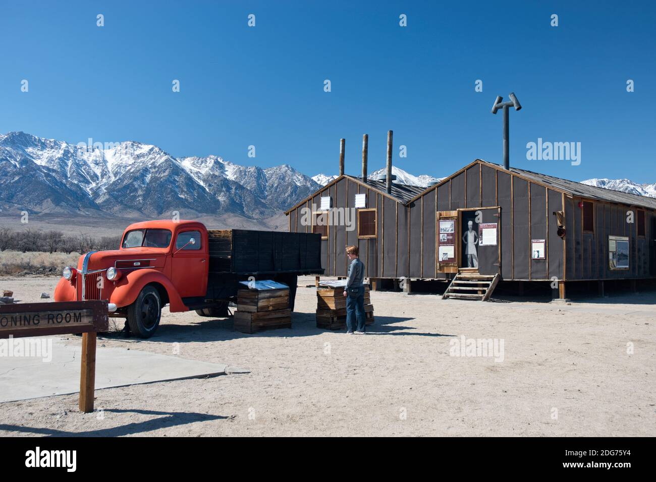 Woman reads about the Block 14 mess hall at Manzanar Nat. Historic Site ...