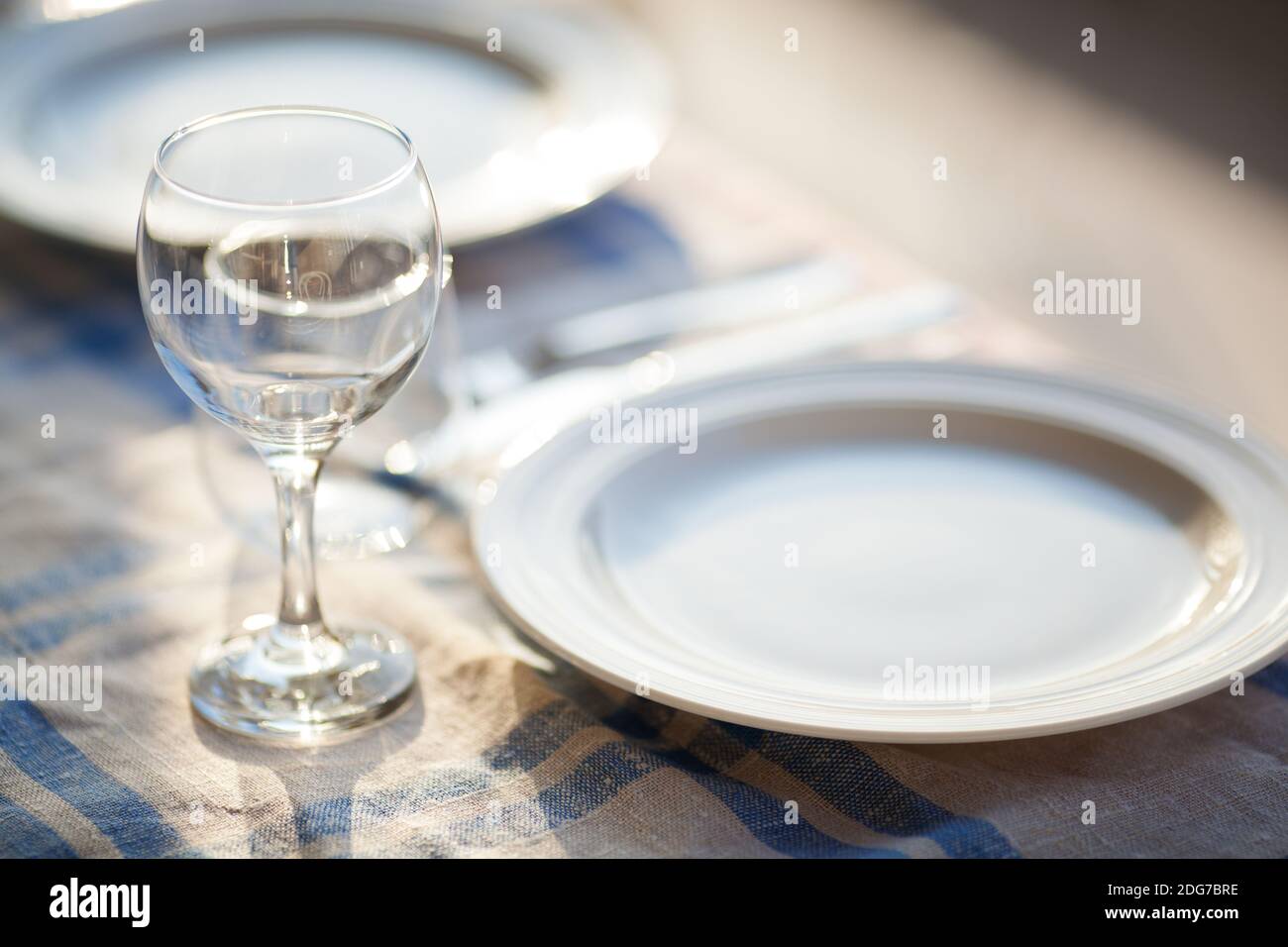 Two clean round empty plates made of porcelain Stock Photo - Alamy