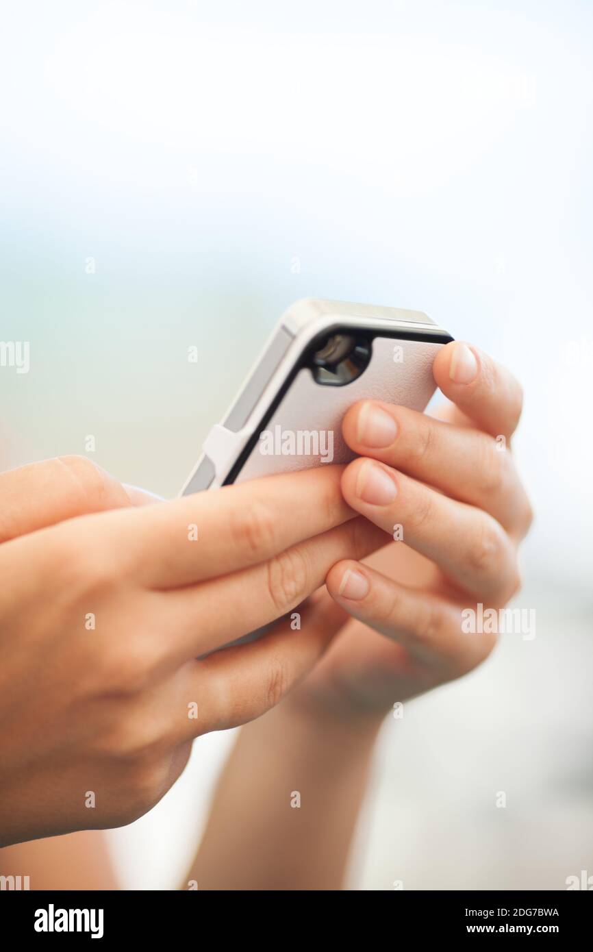 Child checking a text message on a mobile Stock Photo - Alamy