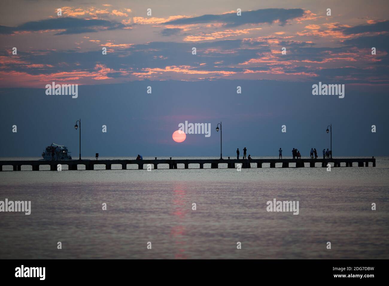 Beautiful sunset under pier Stock Photo - Alamy